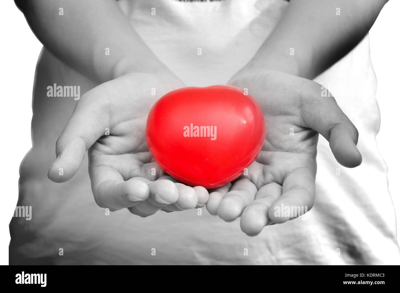 Heart in heart hands Stock Photo - Alamy