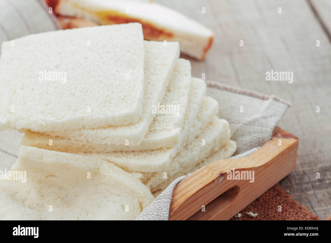 Bread laid in a tray on wooden floor Stock Photo - Alamy