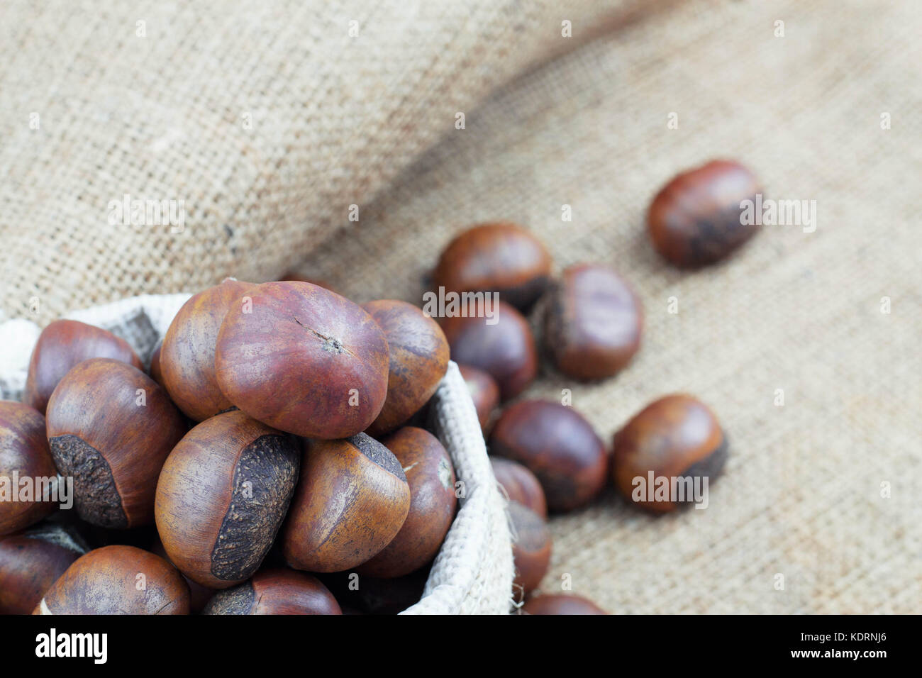 Roasted chestnuts in a bag of sackcloth Stock Photo - Alamy