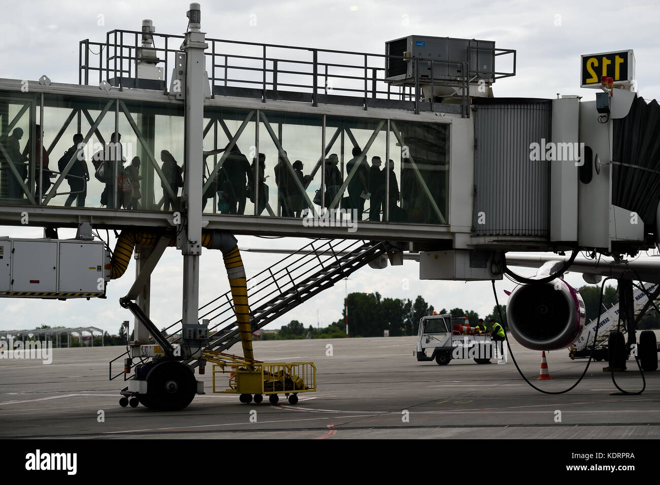Passengers boarding on airplane through a jetway Stock Photo - Alamy