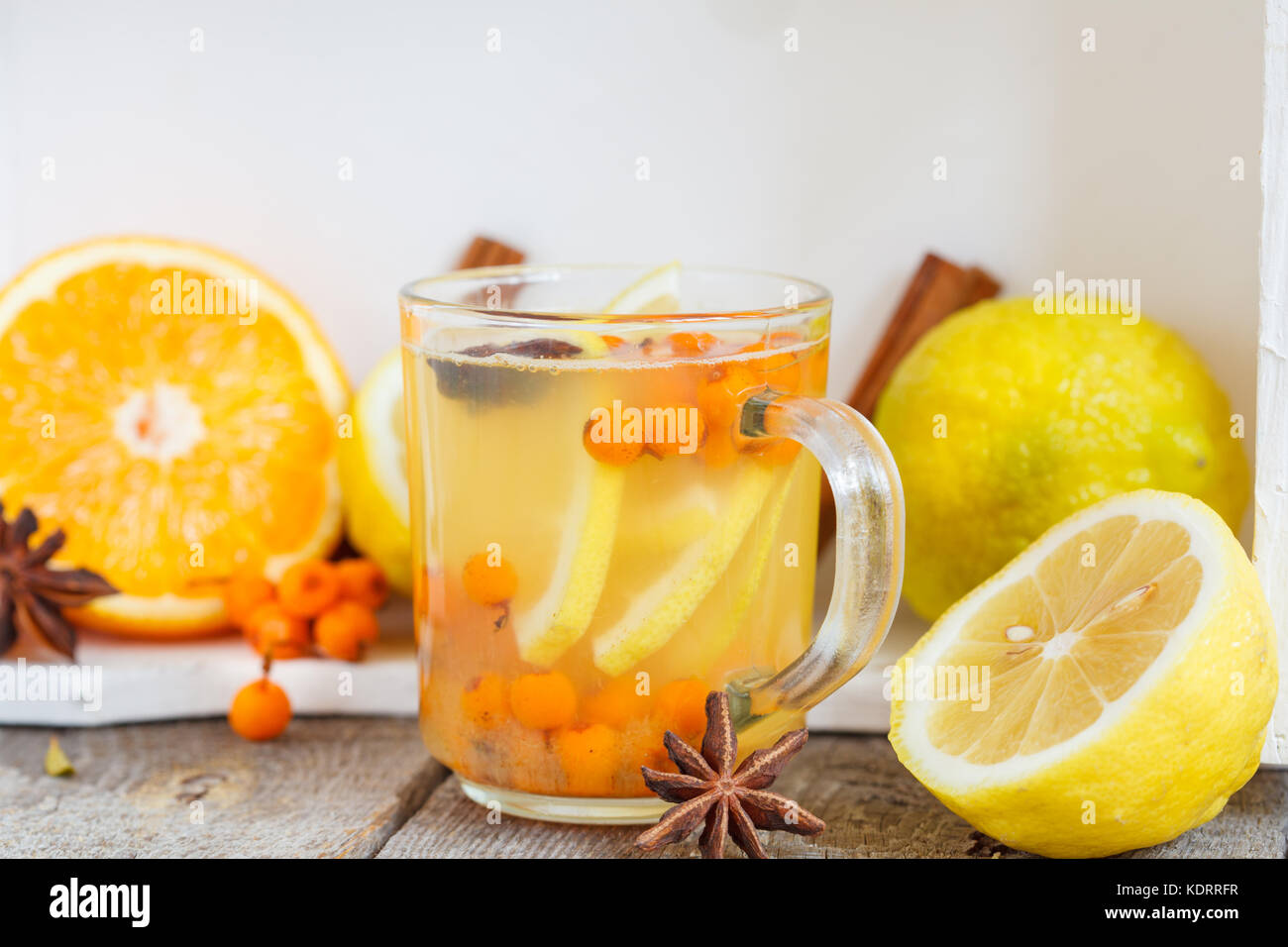 Hot drink with lemon buckthorn, autumn curative drink Stock Photo - Alamy