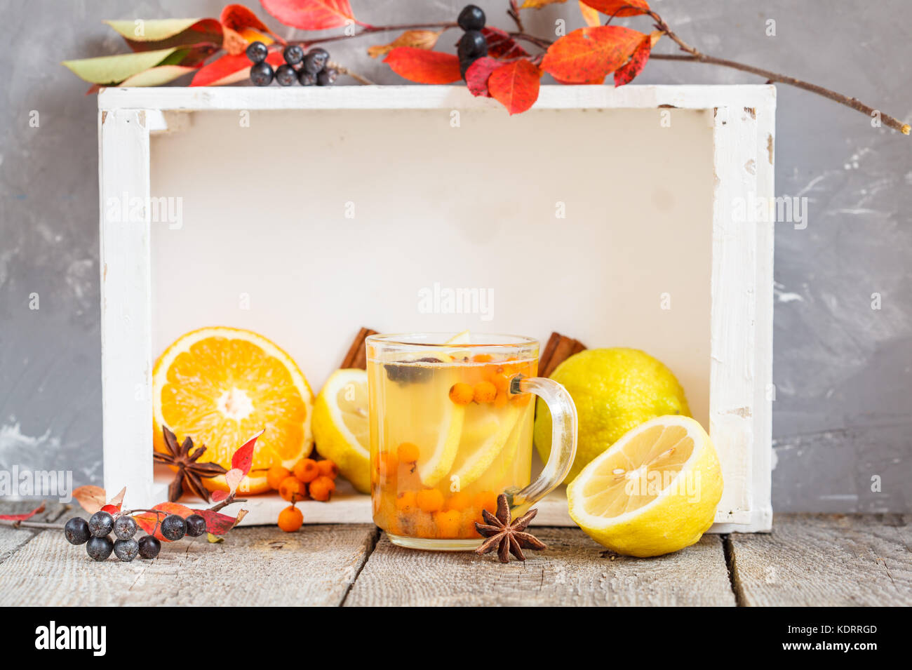Hot drink with lemon buckthorn, autumn curative drink Stock Photo - Alamy