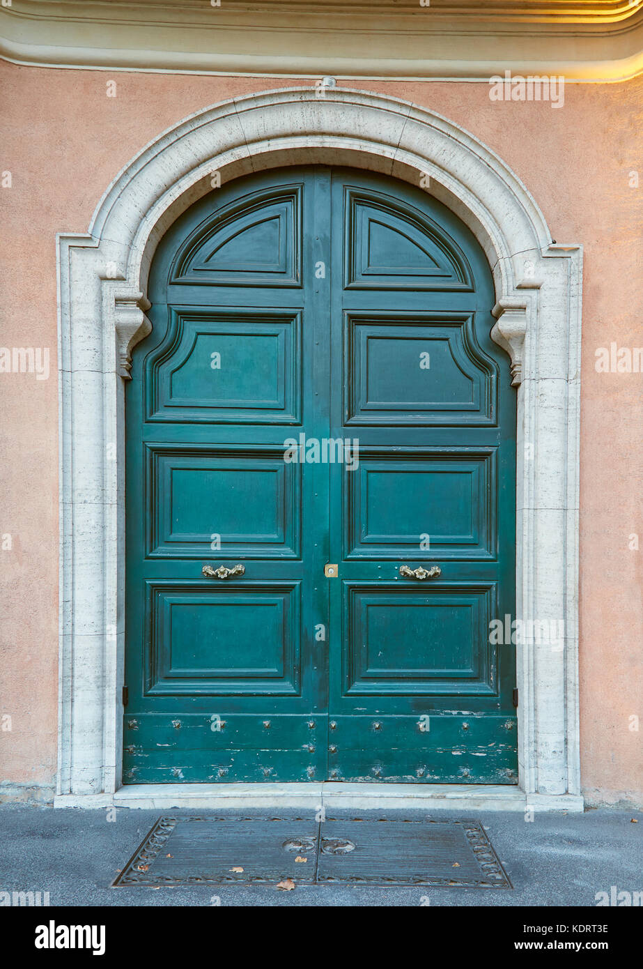 Ancient green door with golden handles in Rome, Italy Stock Photo - Alamy