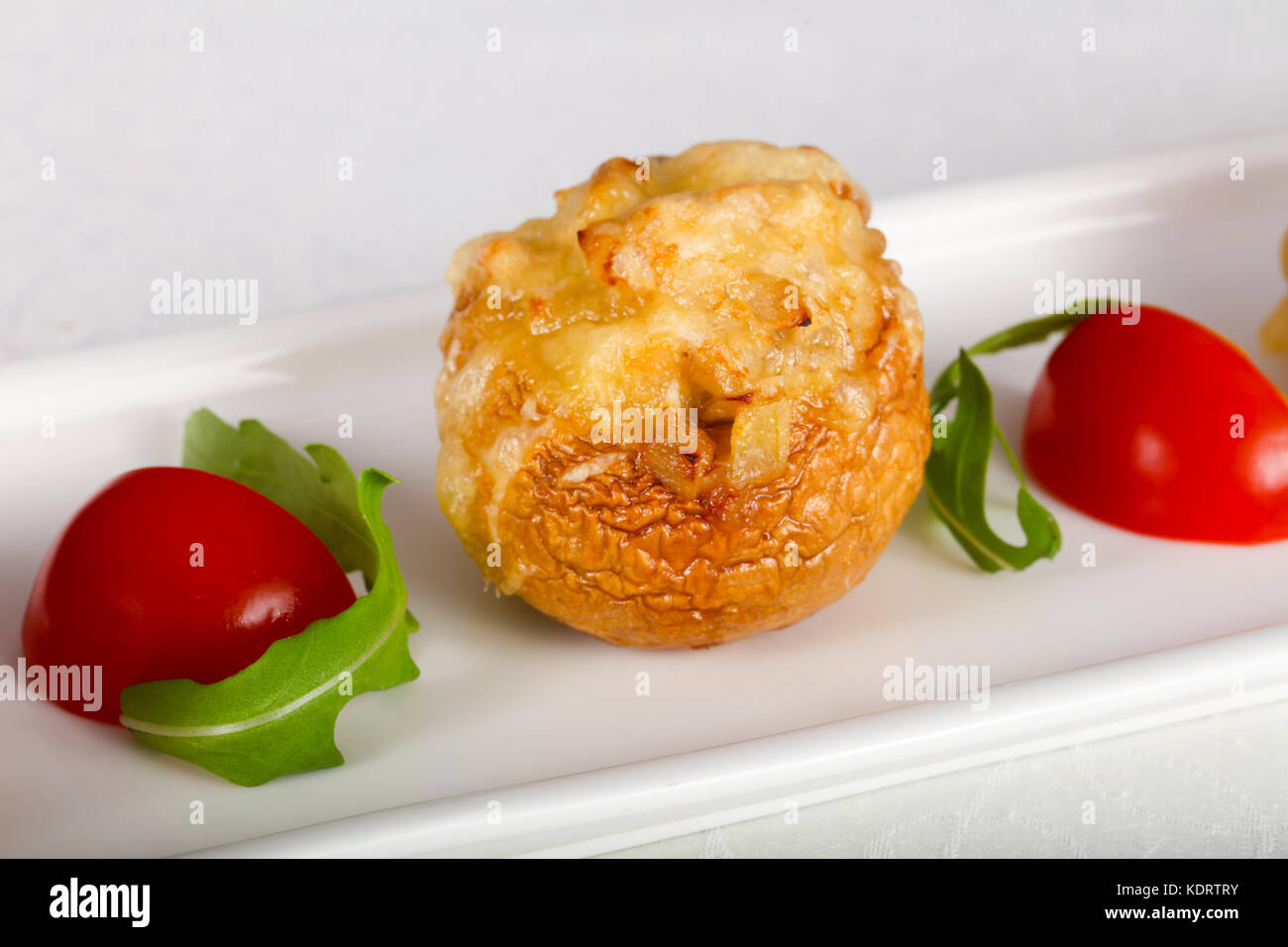 Baked mushrooms champignon with cheese Stock Photo - Alamy