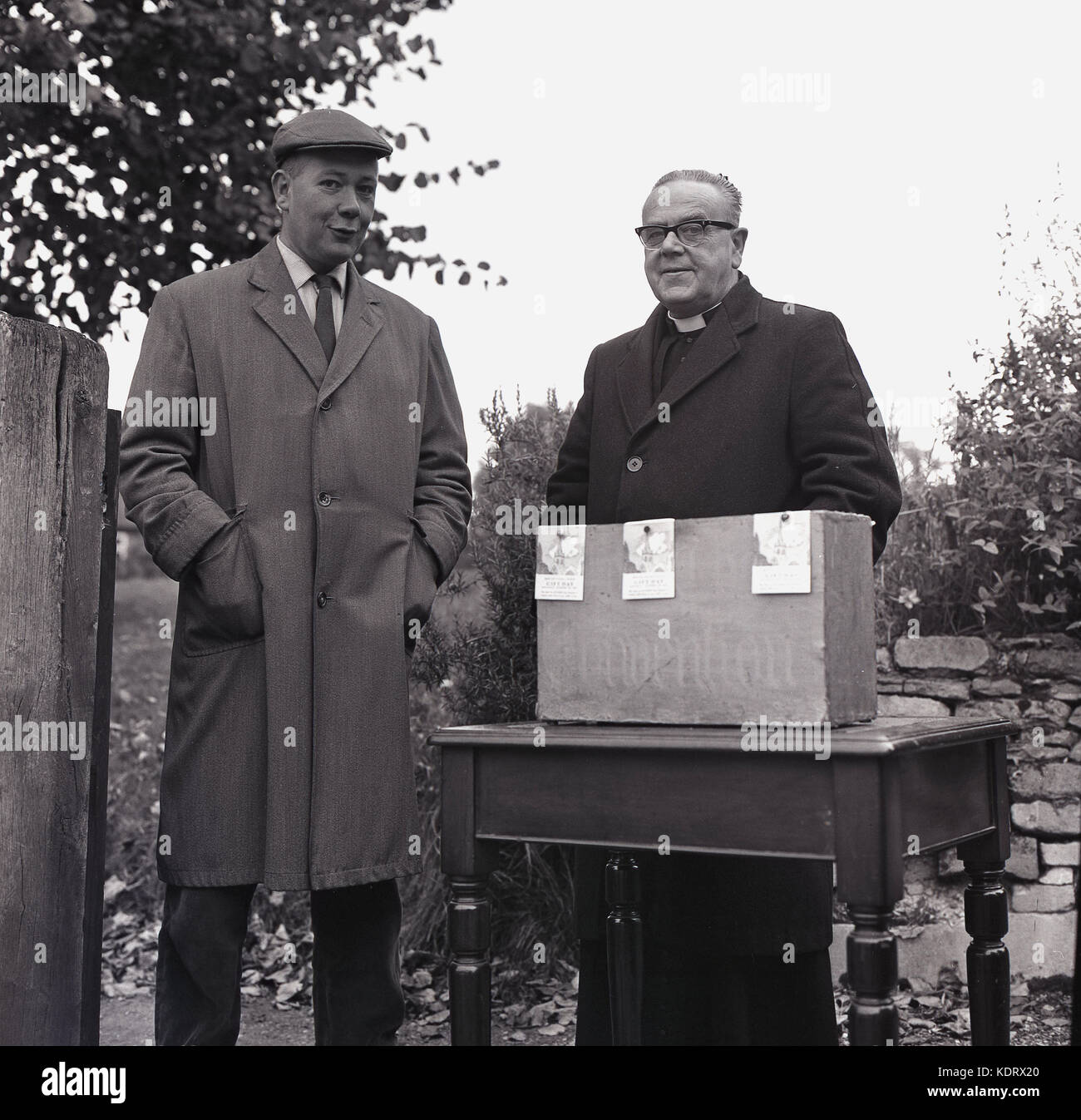 1960s, historical picture, two men, an elderly priest and a local ...
