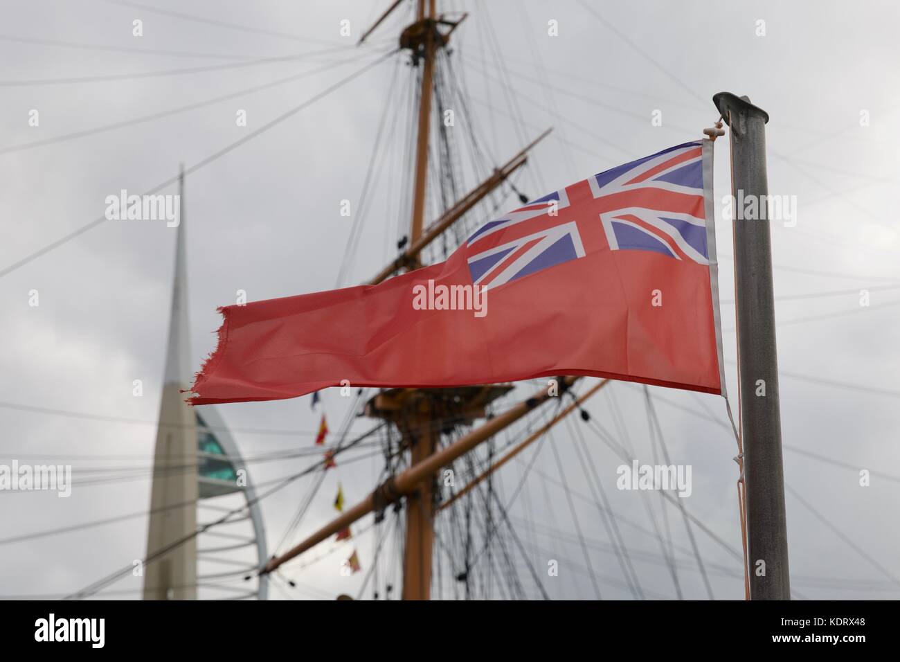 British merchant flag with HMS Warrior and Spinnaker Tower in the ...