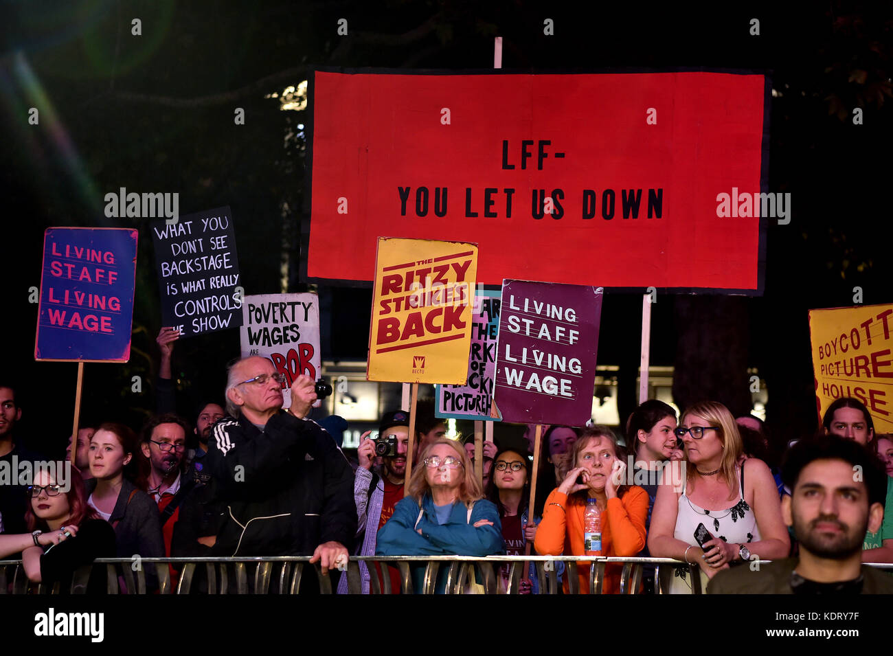 Protesters with signs campaigning for the living wage attending the ...