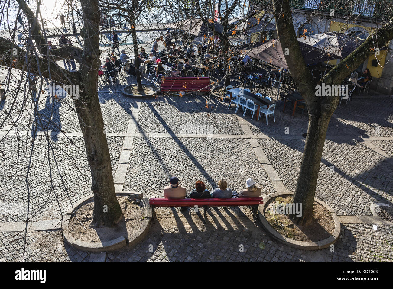 Portuguese people on a bench on a small square in Porto city, second ...