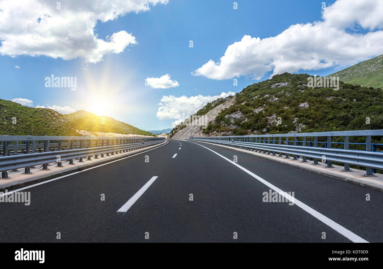 High-speed country road among the mountains Stock Photo - Alamy