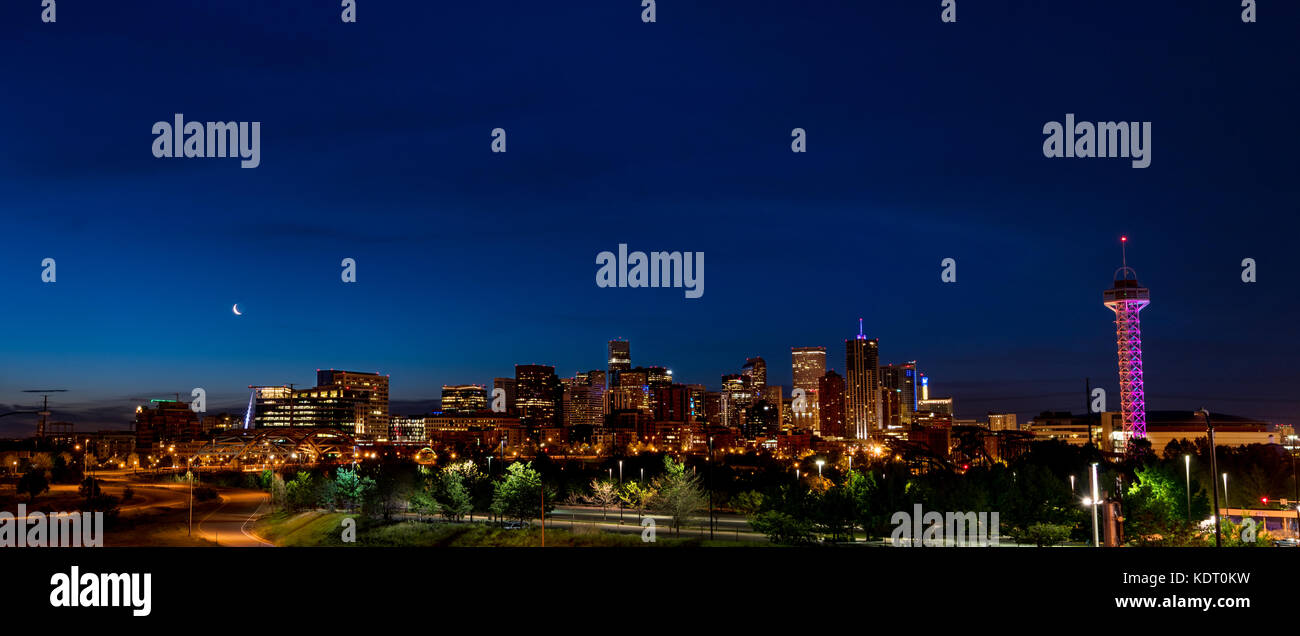 City lights of Denver at night with blue morning sky and moon Stock ...