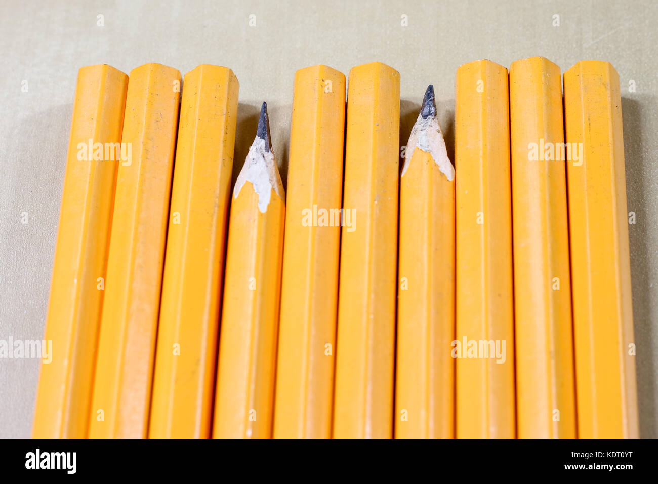 crayons and pencil sharpener on a wooden office table. Crayons with ...