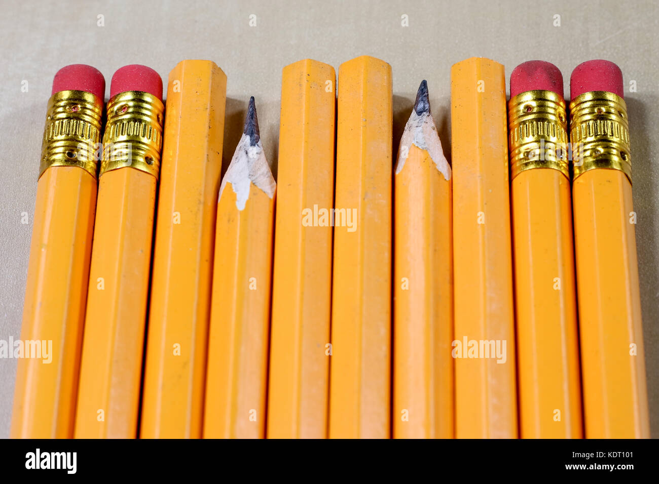 crayons and pencil sharpener on a wooden office table. Crayons with ...