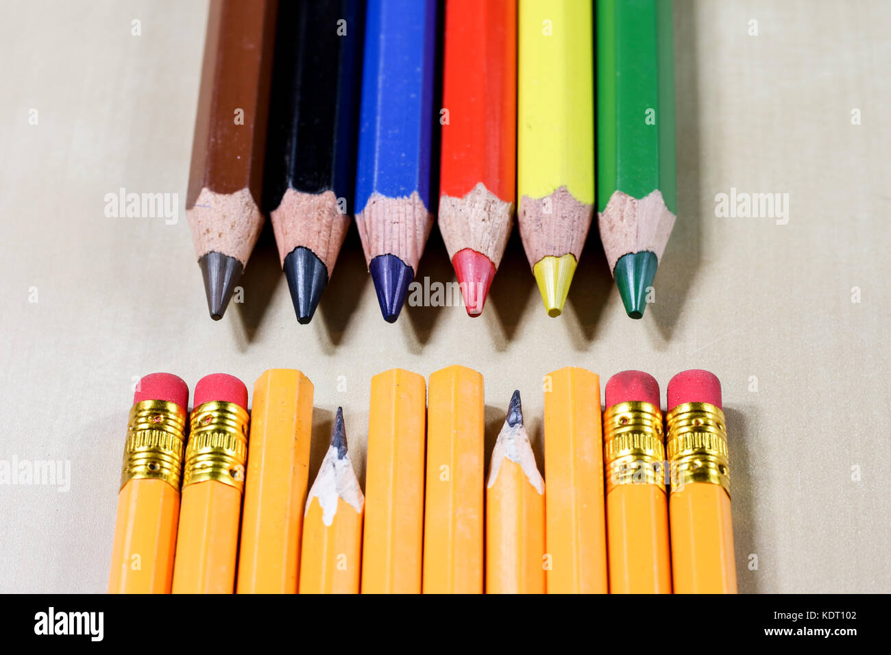 crayons and pencil sharpener on a wooden office table. Crayons with ...