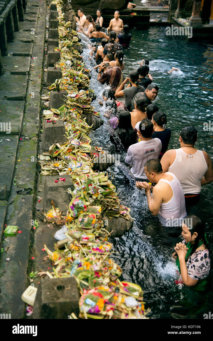 Bali, Indonesia - July 06, 2017. People praying at Holy water temple ...