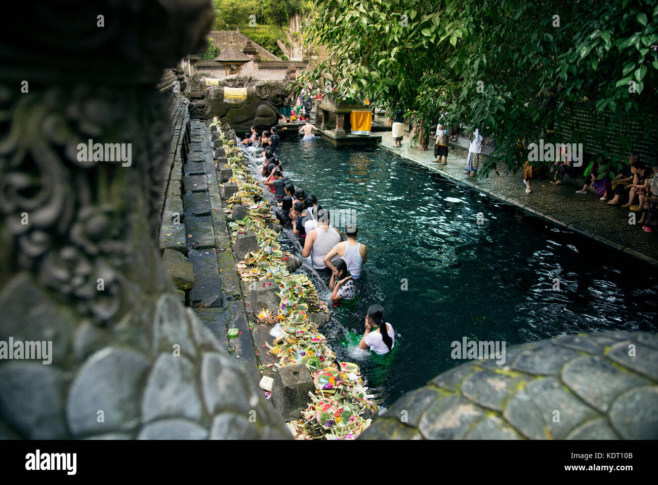 Bali, Indonesia - July 06, 2017. People praying at Holy water temple ...