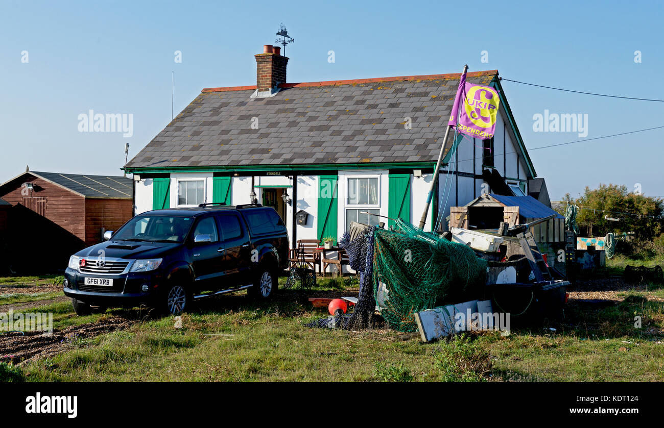UKIP flag flying next to shack on the shingle at Dungeness, Kent ...