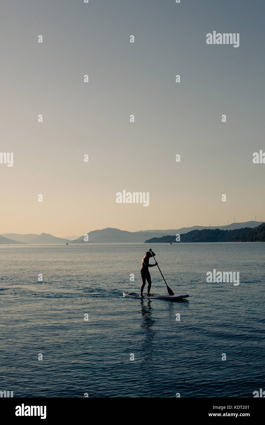 Paddle board in silhouette hi-res stock photography and images - Alamy