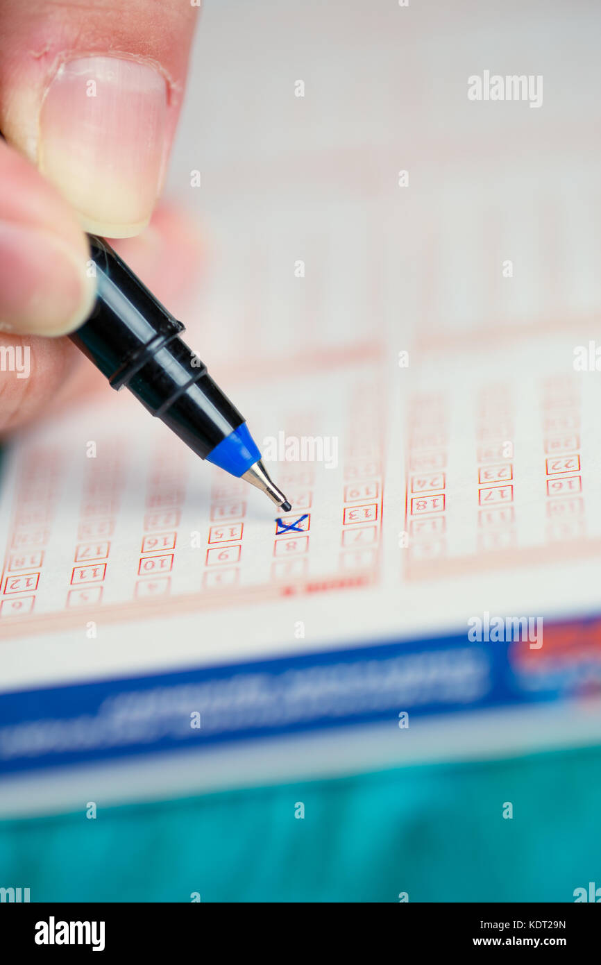 Photo of man's hand with lottery ticket Stock Photo - Alamy