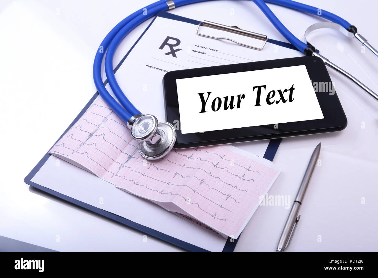 Closeup of stethoscope on a rx prescription, red heart and phone ...