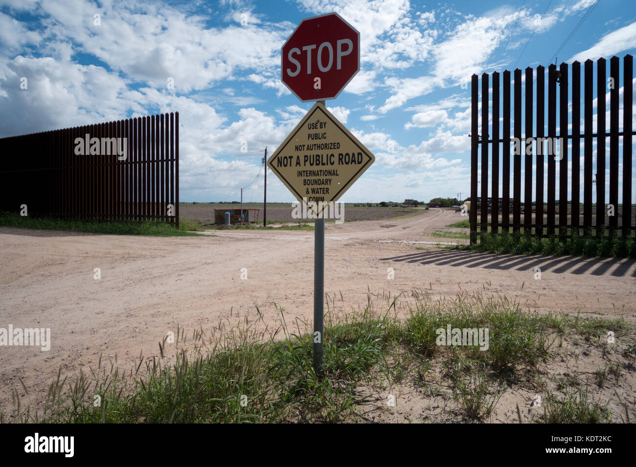 Texas border fence sits atop a dike near the Texas/Mexico border. This ...