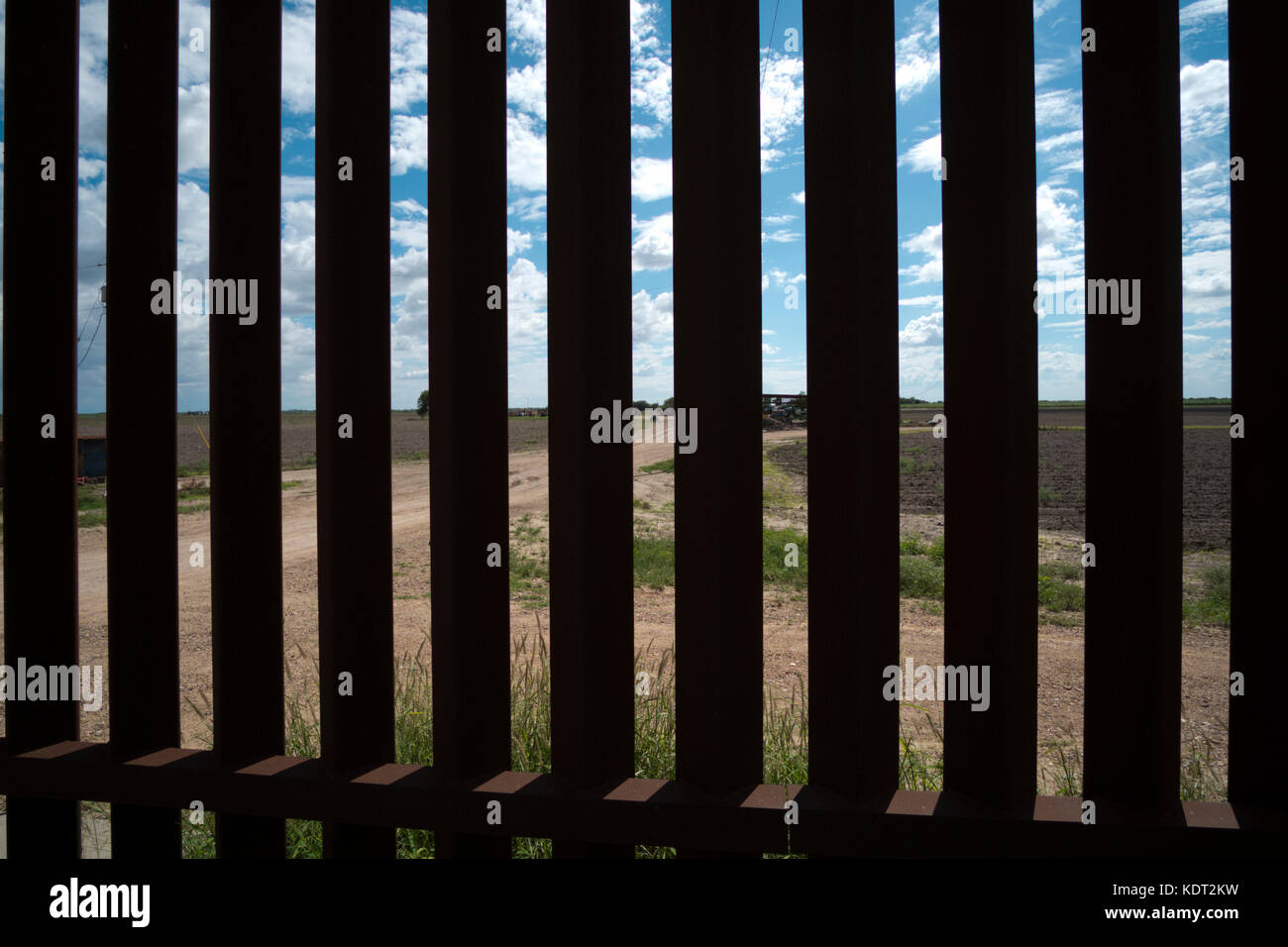 Texas border fence sits atop a dike near the Texas/Mexico border. This ...