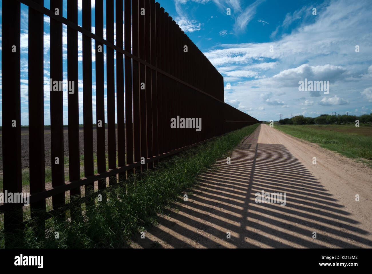 Texas border fence sits atop a dike near the Texas/Mexico border. This ...