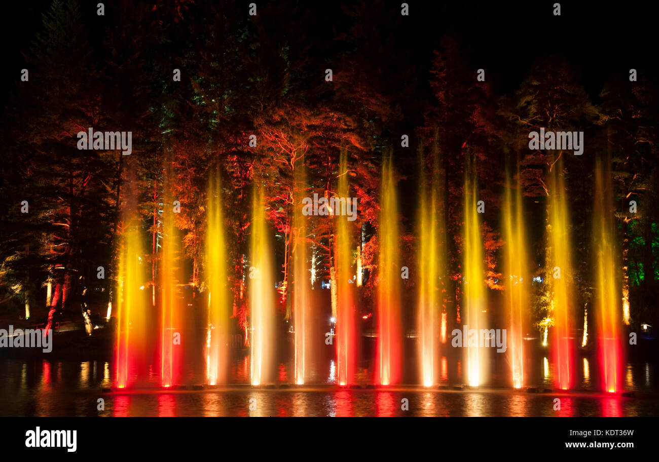 An illuminated water fountain installation at night in Loch Dunmore in ...