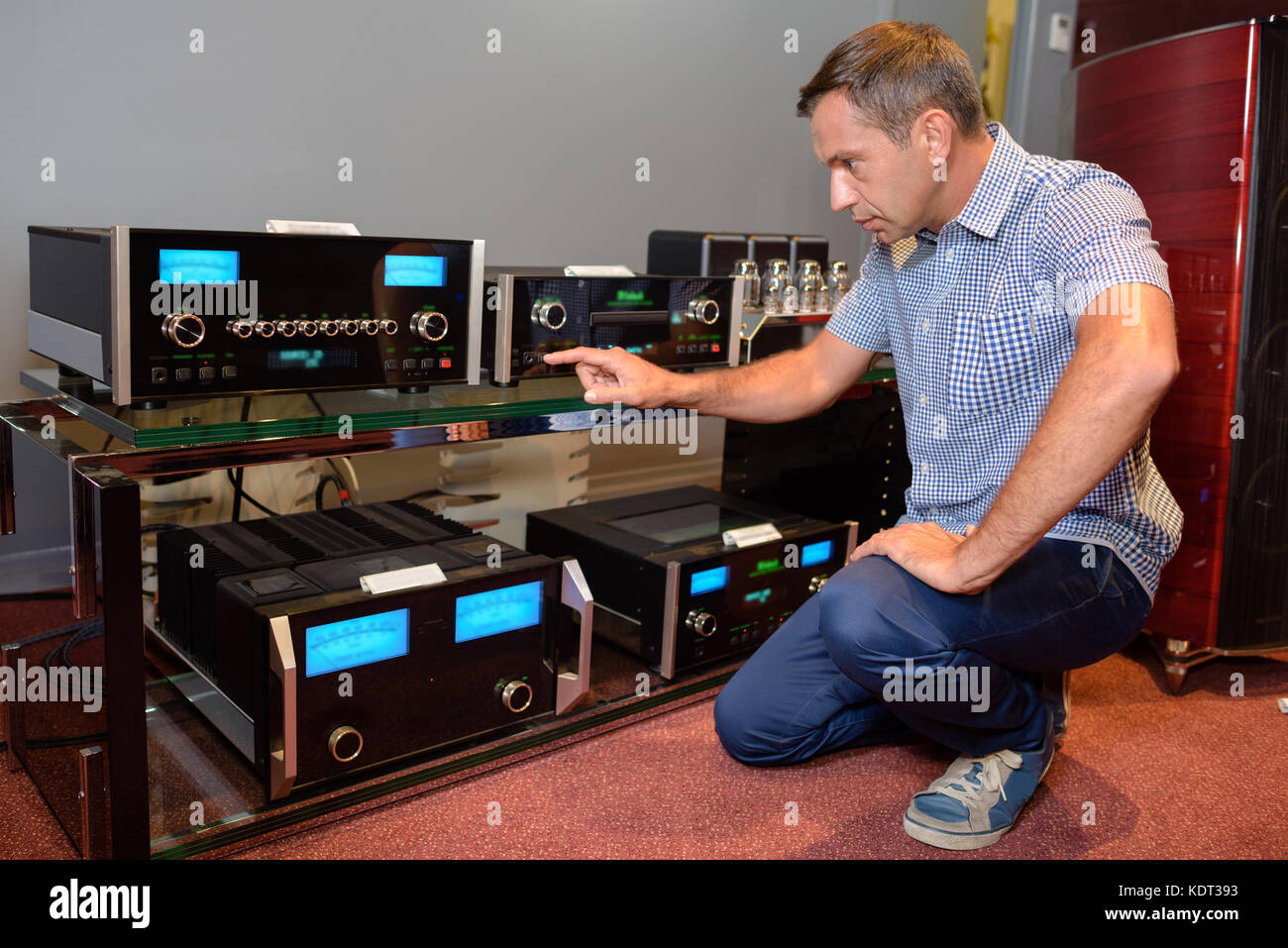 Man setting up technical equipment Stock Photo - Alamy