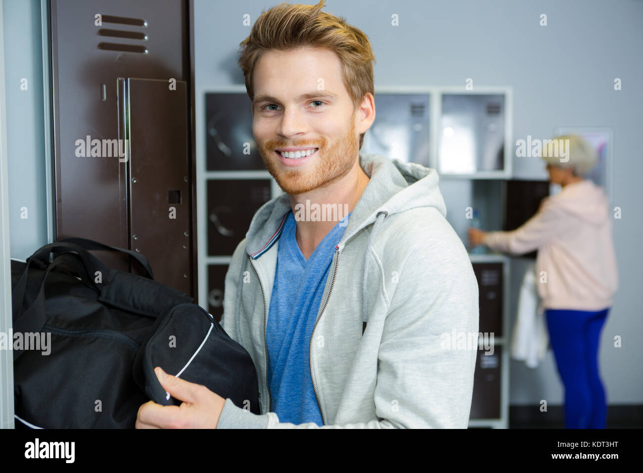 young man in sports changing room Stock Photo - Alamy