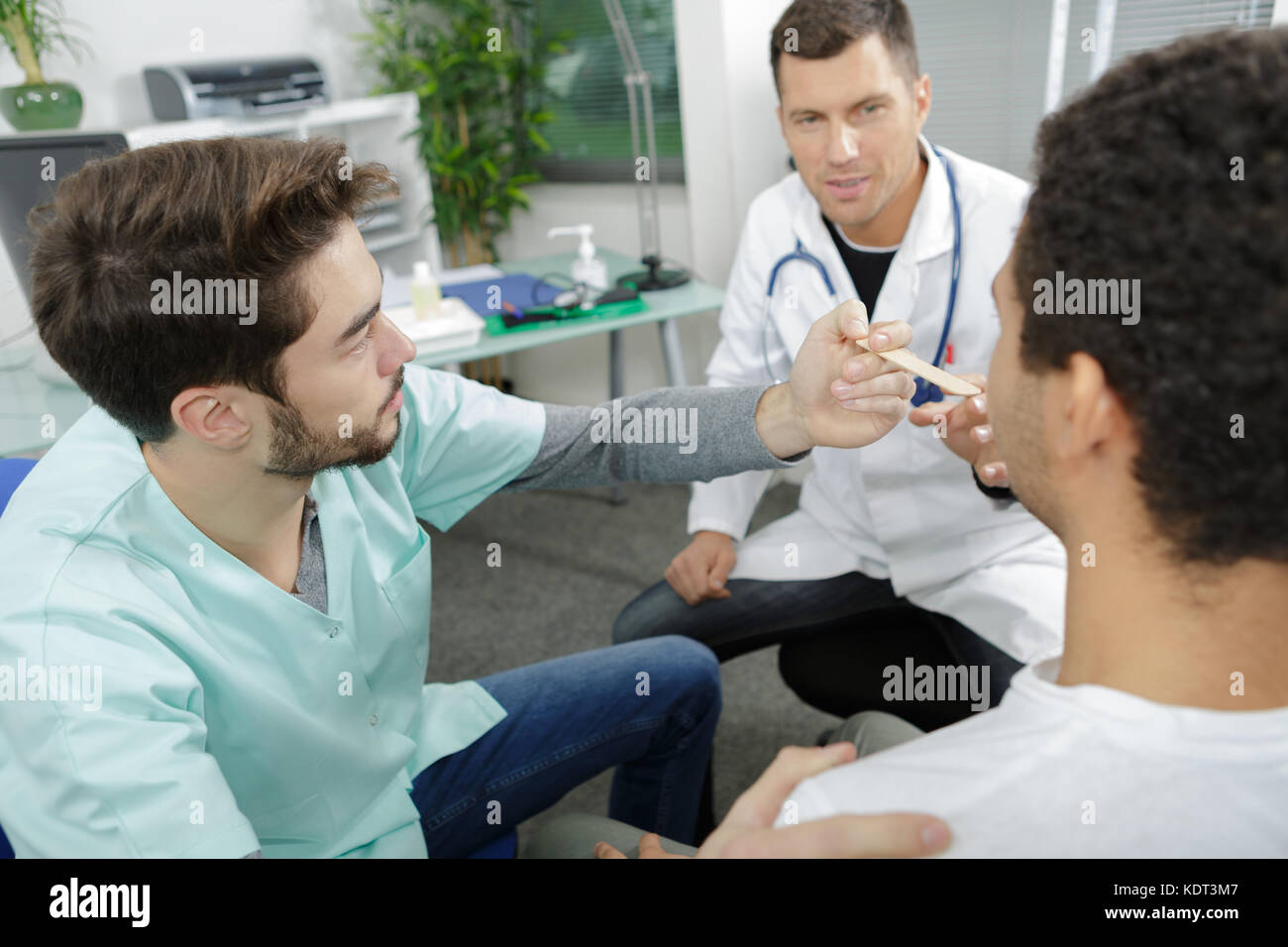 nurse inspecting the patient Stock Photo - Alamy
