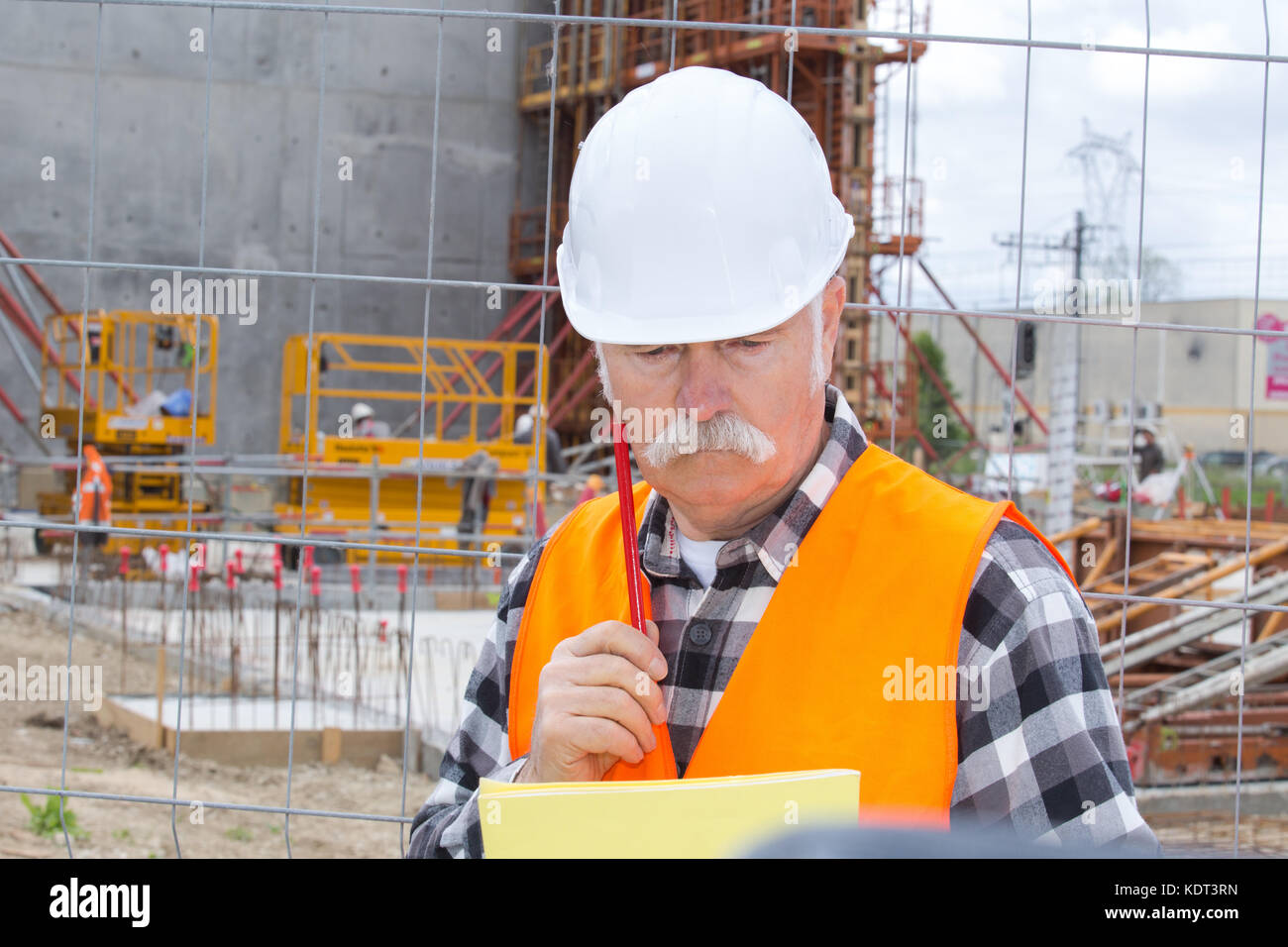 foreman reading a letter Stock Photo - Alamy