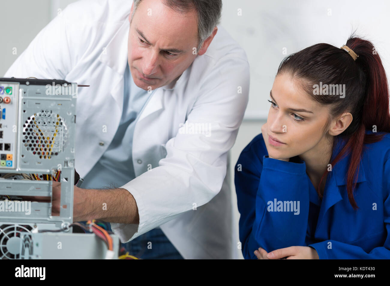 happy technical support engineer doing malfunction diagnosis of client ...