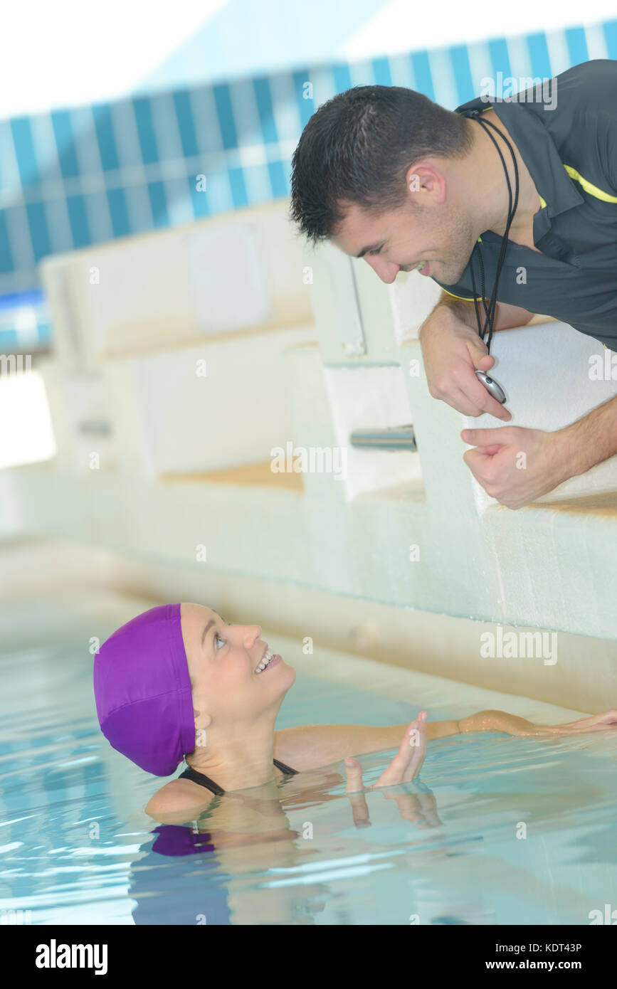 male swimming coach with female swimer Stock Photo - Alamy