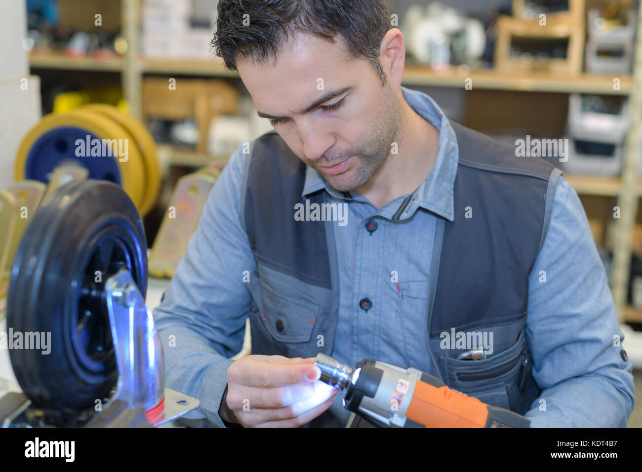 factory worker testing a wheel Stock Photo - Alamy