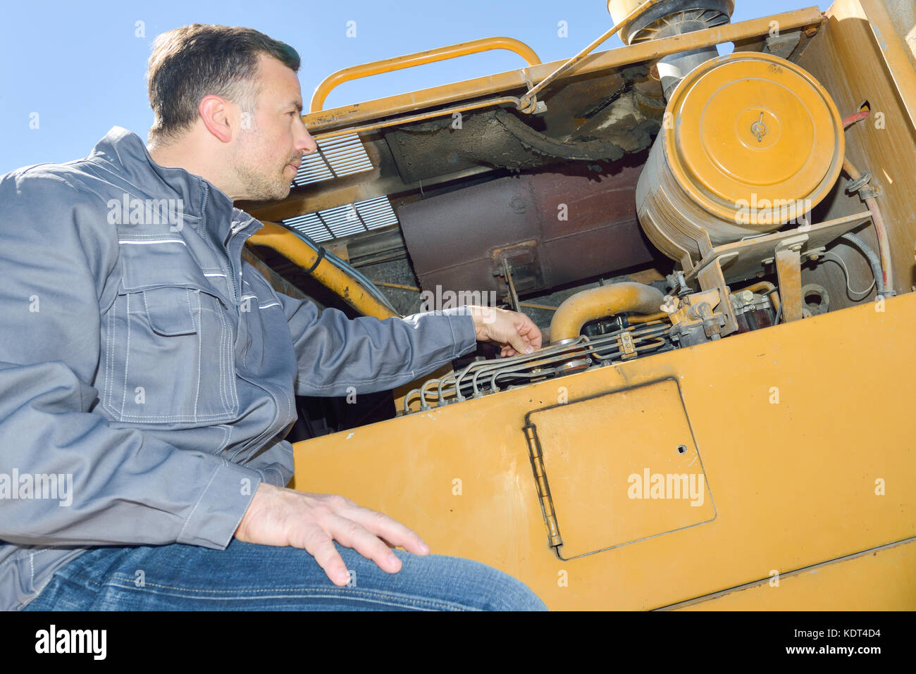 mechanic checking cranes engine Stock Photo - Alamy