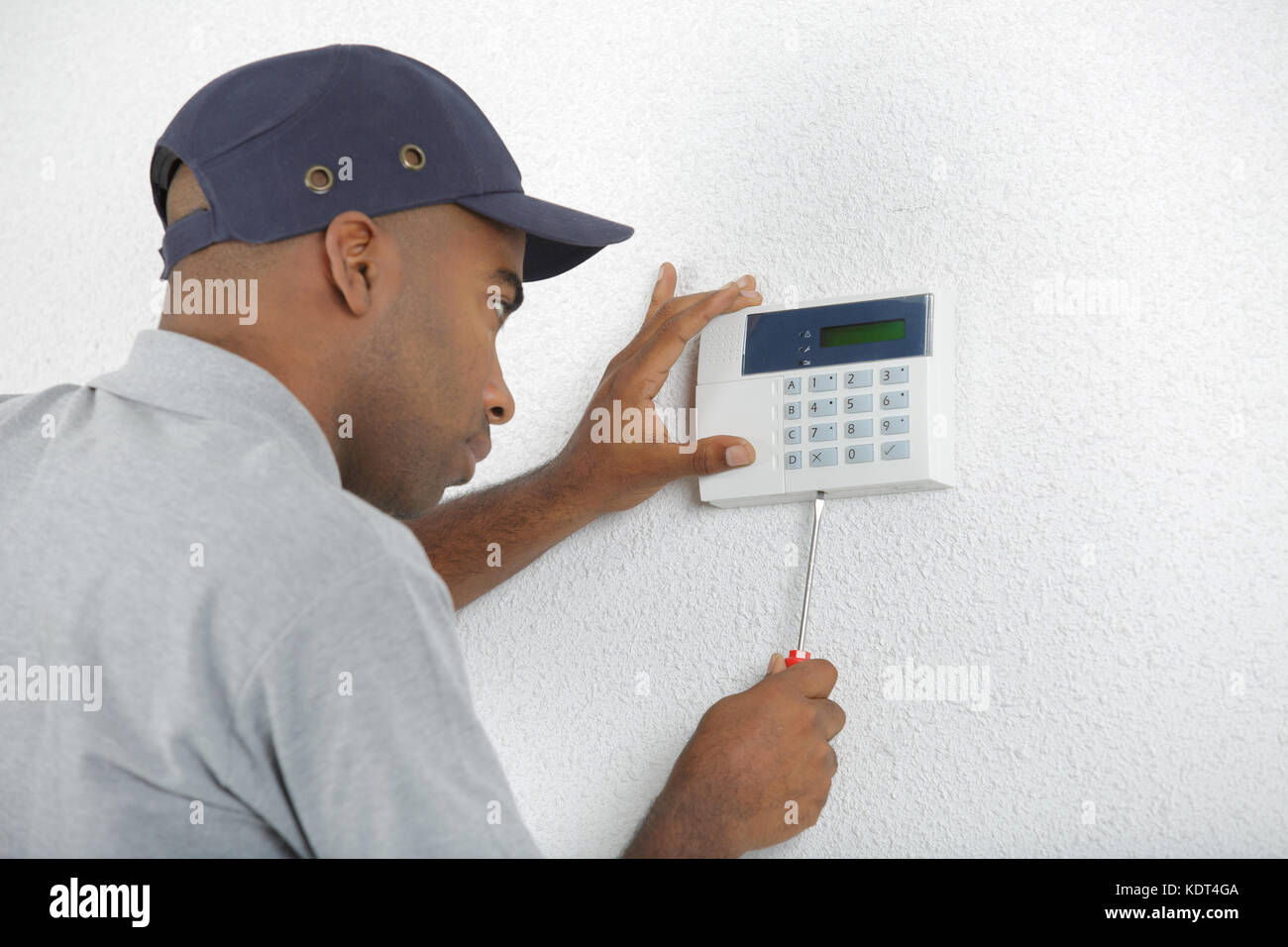 electrician fitting electronic keypad Stock Photo - Alamy