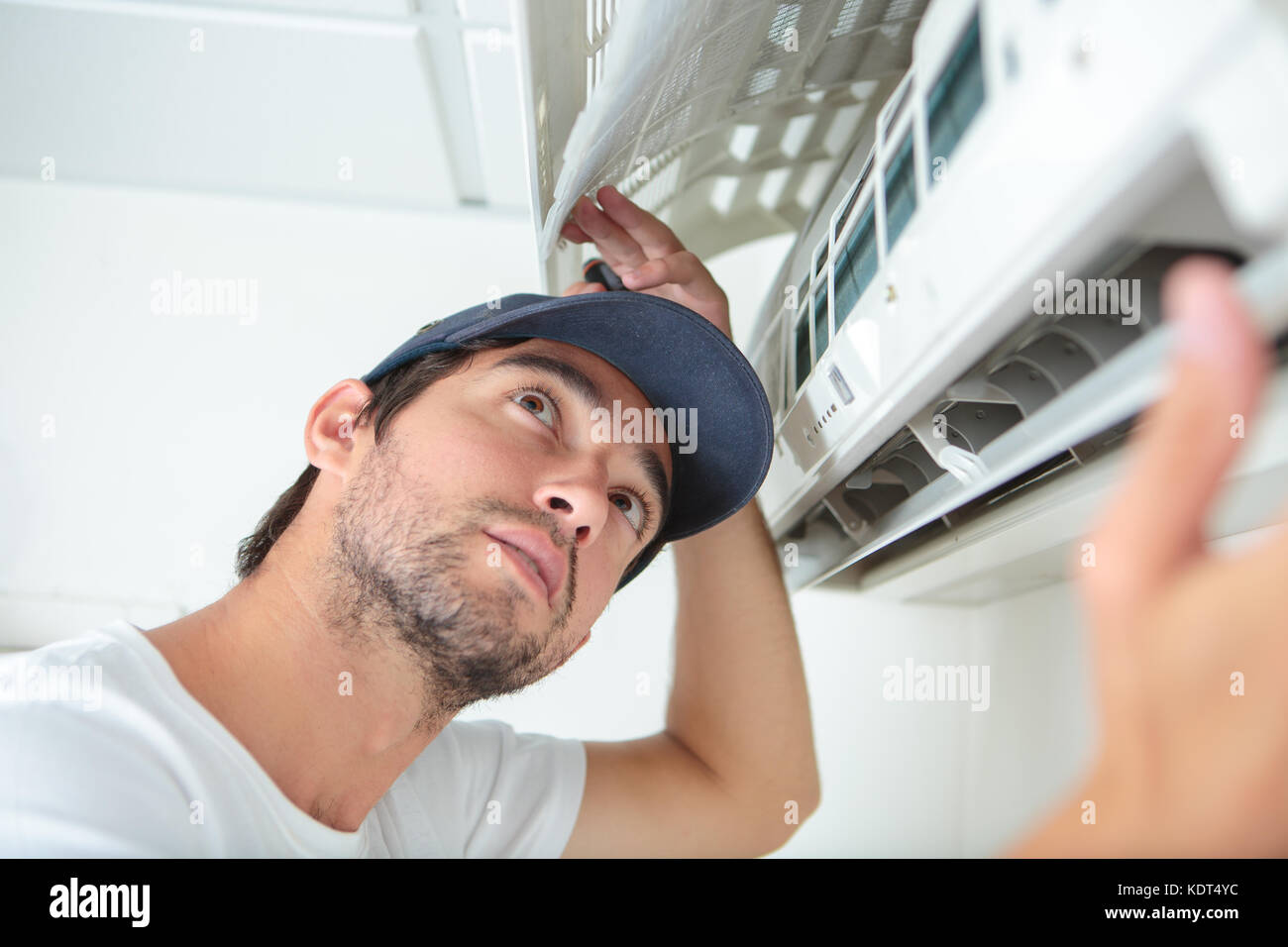 fixing and maintaining air conditioning system Stock Photo - Alamy