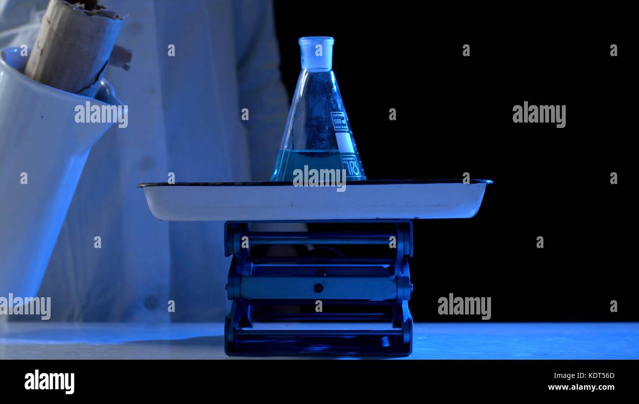 Bottle and liquid nitrogen in a laboratory. Chemical experiment. Flask ...