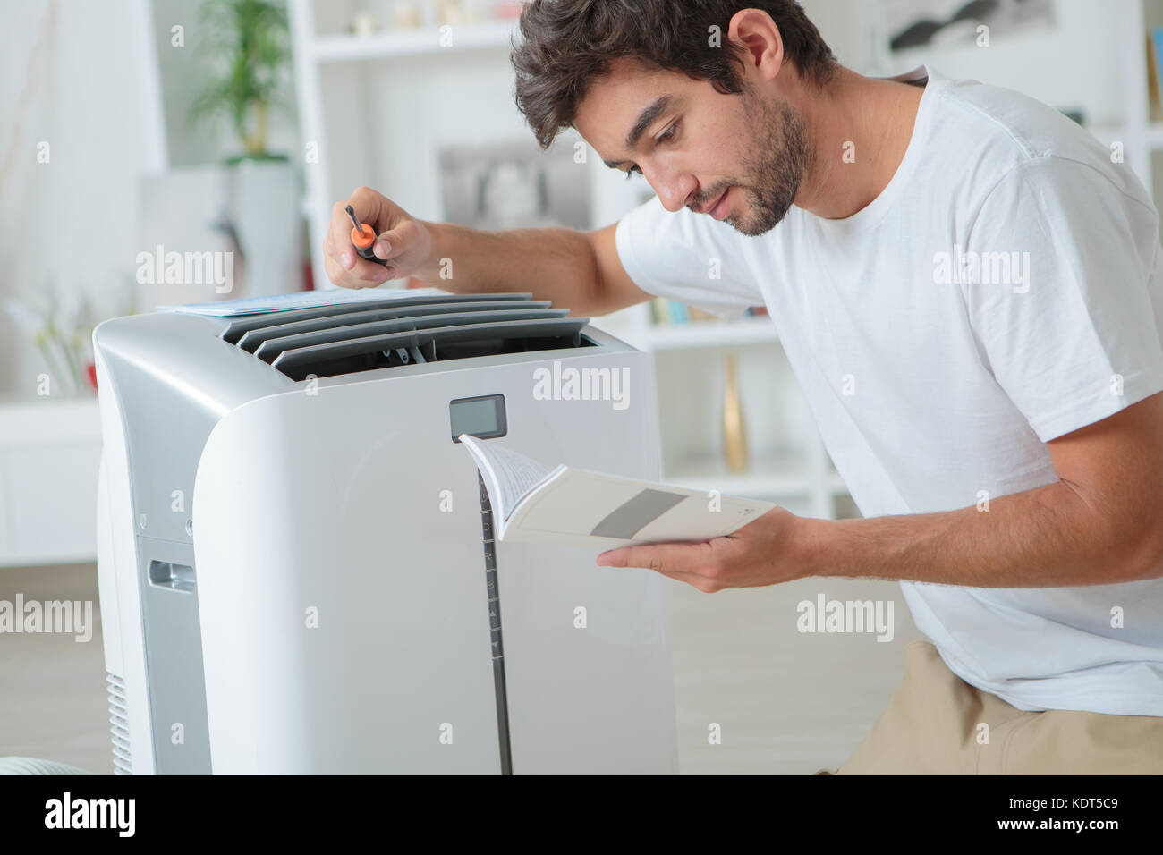 reading the booklet of manual Stock Photo - Alamy