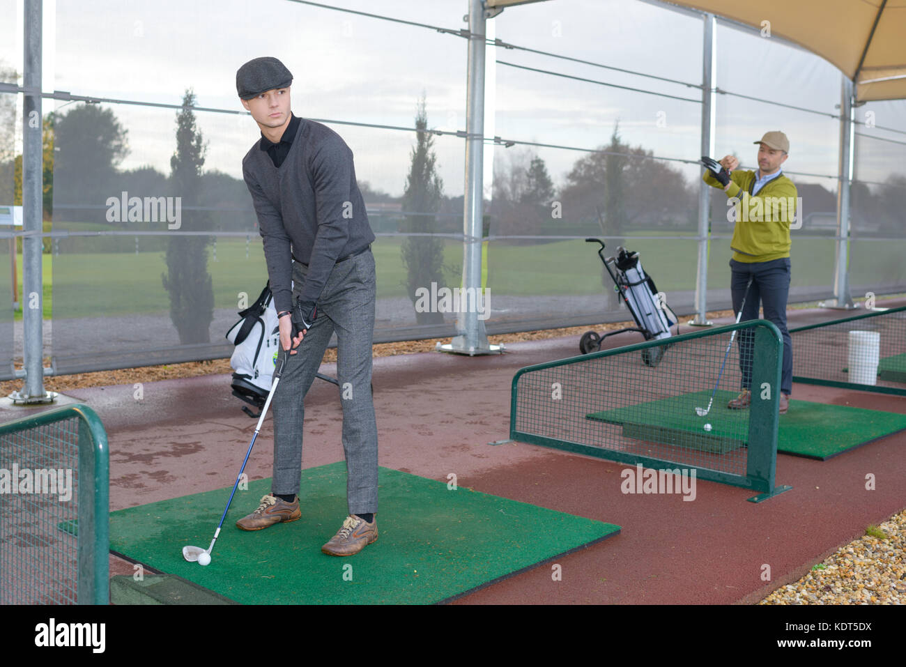 men at golf course Stock Photo - Alamy