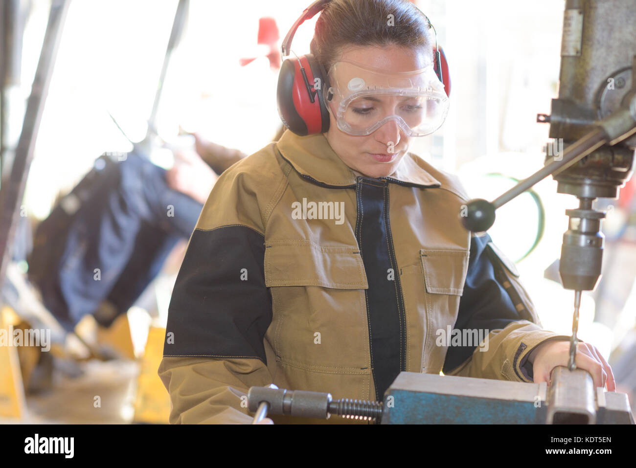 manufacturing worker operating a machine Stock Photo - Alamy
