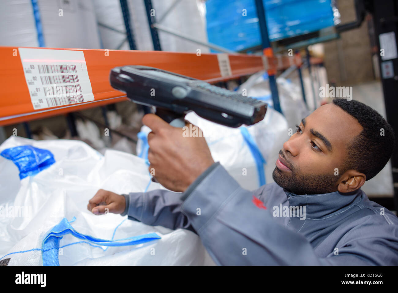 man scanning by handheld device Stock Photo - Alamy