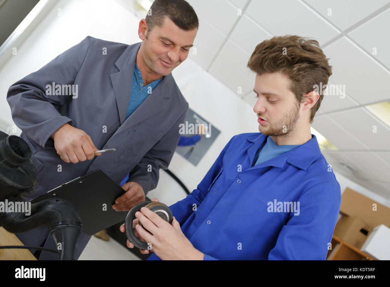 student with auto part studying automotive trade Stock Photo - Alamy