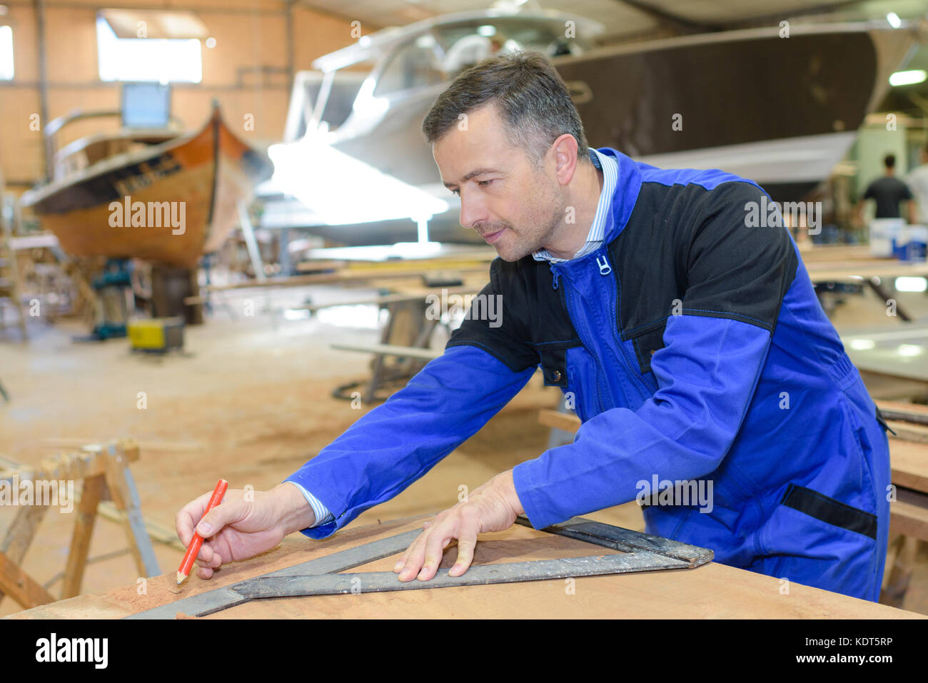fixing a boat Stock Photo - Alamy
