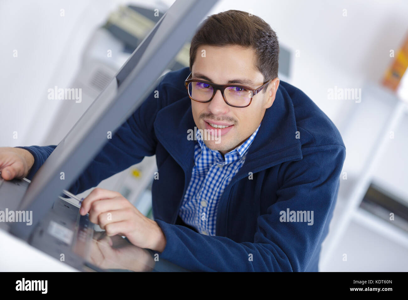 young handsome man scanning documents Stock Photo - Alamy