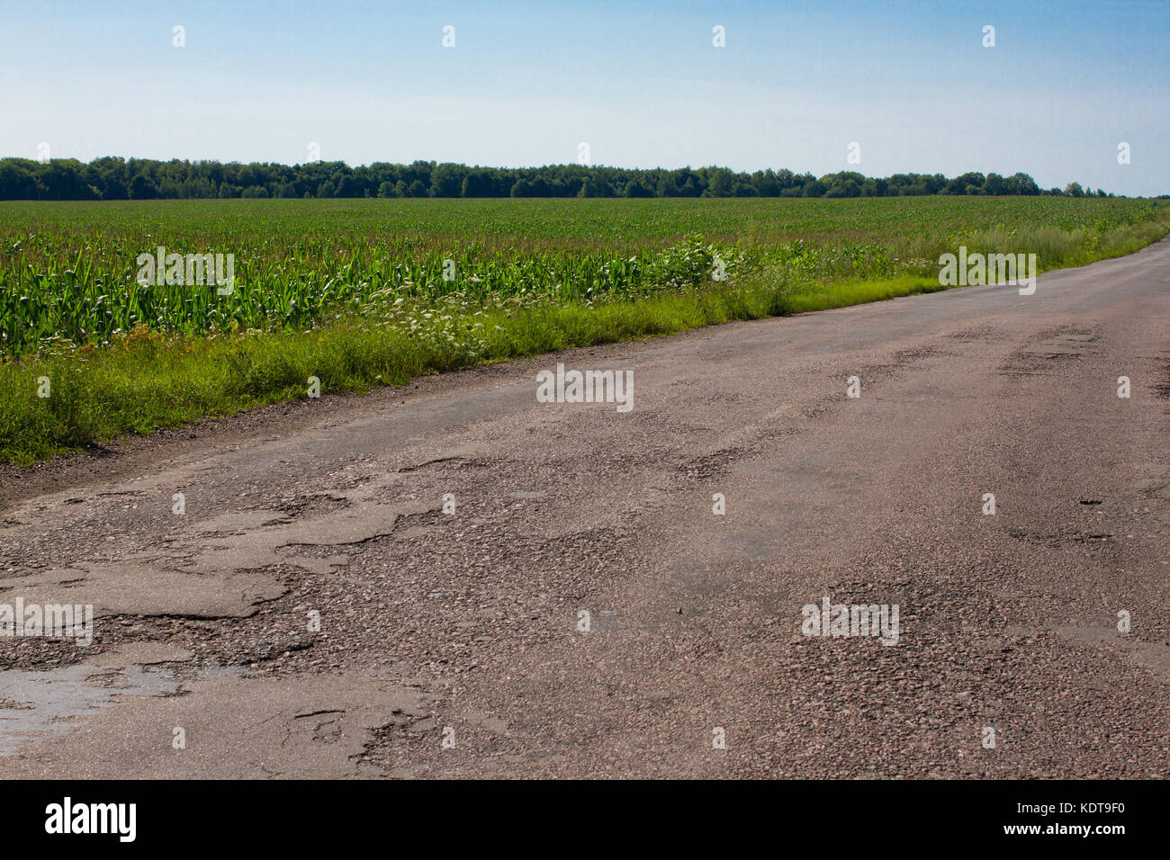 Broken asphalt on roads in Ukraine. Ruined track Stock Photo - Alamy