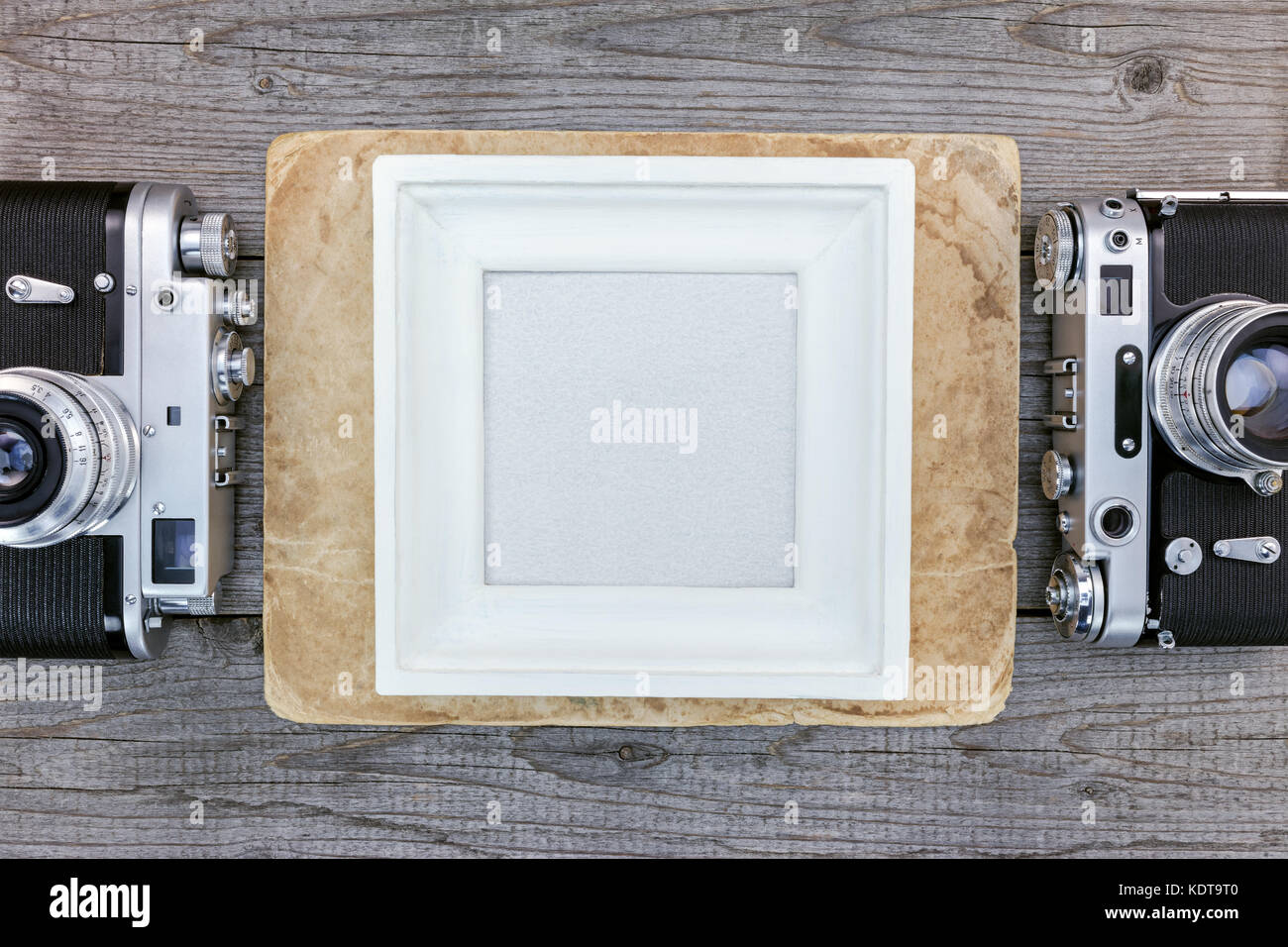 vintage old cameras and empty frame for photo on old wooden table Stock ...