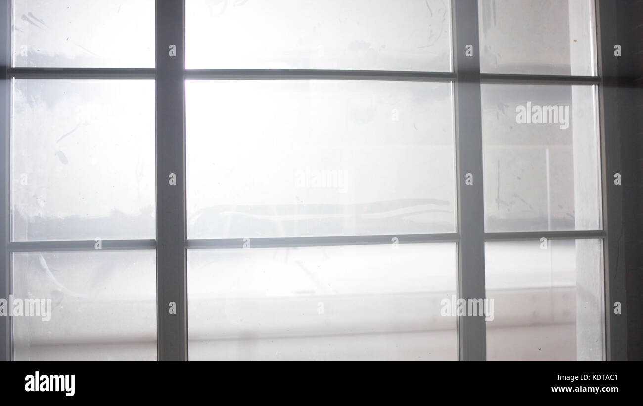 Bright white light outside the window. Spotlight outside the window ...