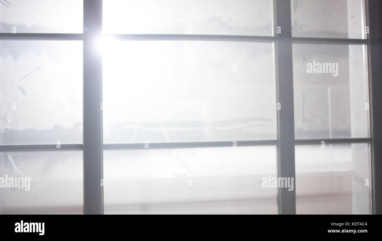 Bright white light outside the window. Spotlight outside the window ...