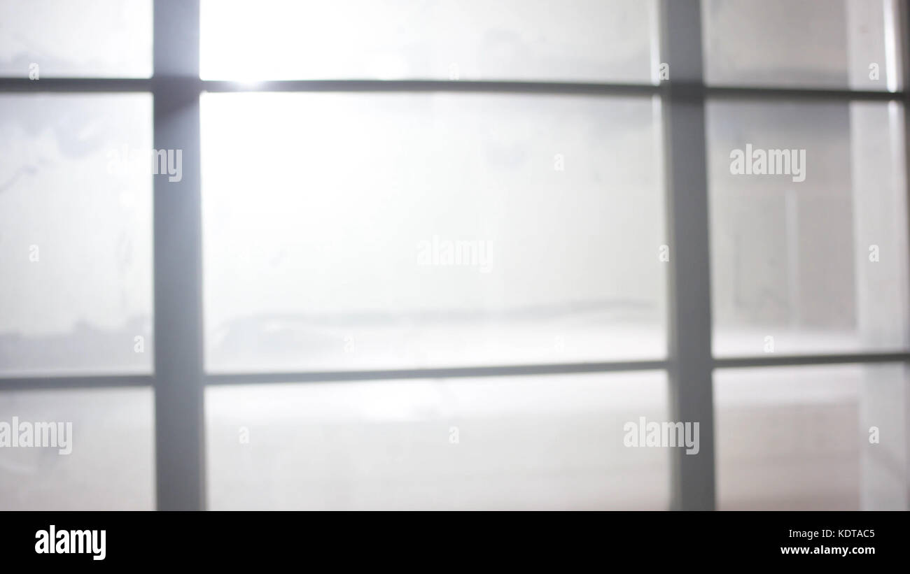 Bright white light outside the window. Spotlight outside the window ...